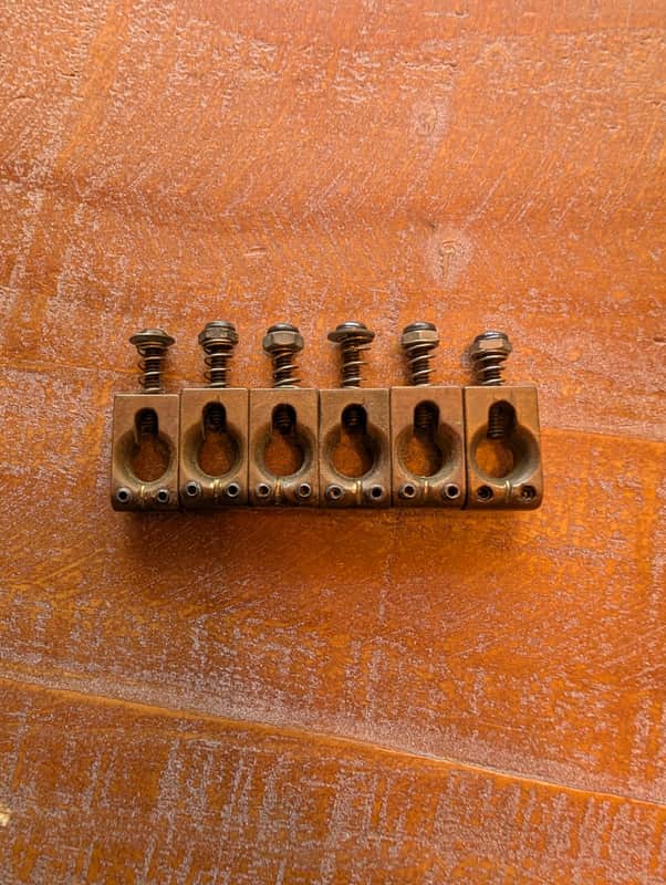 Vintage Mighty Might Brass Keyhole Guitar Bridge Saddles | Reverb