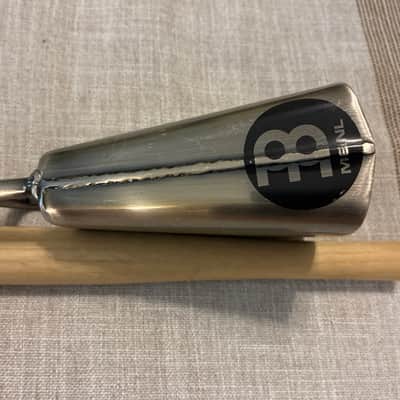 Meinl 4 1/2" handheld cowbell, hand brushed steel 2022 - hand | Reverb