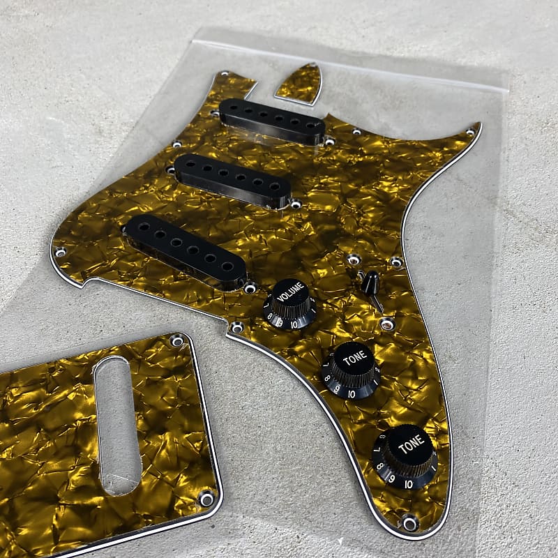 Silver Sky Se Gold pearl pickguard & black pickup covers | Reverb