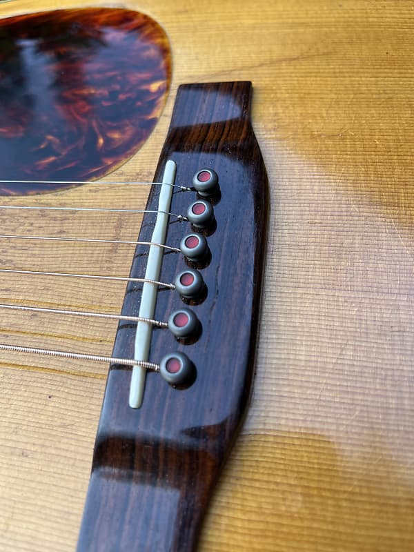 Martin Luxe Liquid Metal Bridge Pins Turkish Emery with Red | Reverb