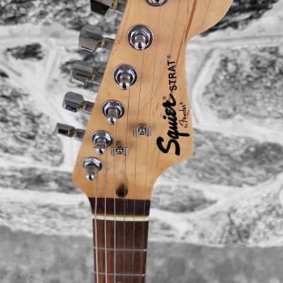 Squier Strat, Black with Pearl Pickguard | Reverb