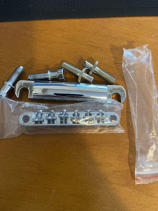 Tune o matic style bridge and tailpiece. | Reverb