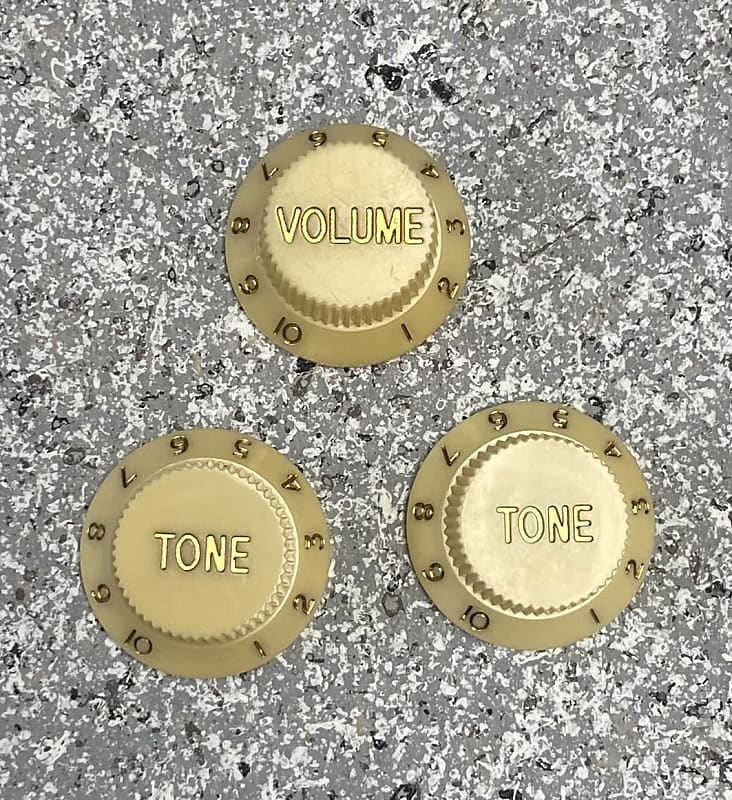 Pro Parts Strat Style Knobs 1 Set of 3 Ivory w/Gold lettering | Reverb