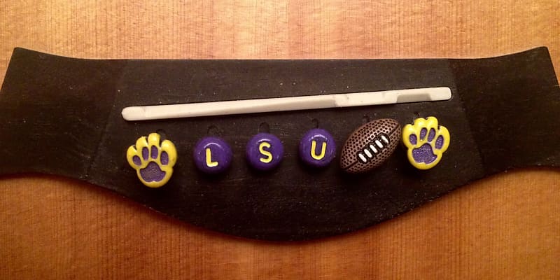 Got Bridge Pins? Ebony Bridge Pins with LSU Football Tops | Reverb