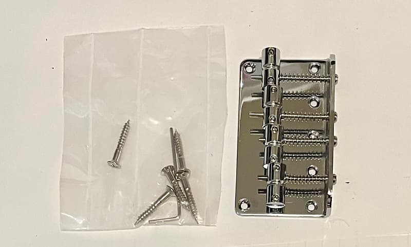 Fender-style bass guitar bridge, 4-string, chrome | Reverb