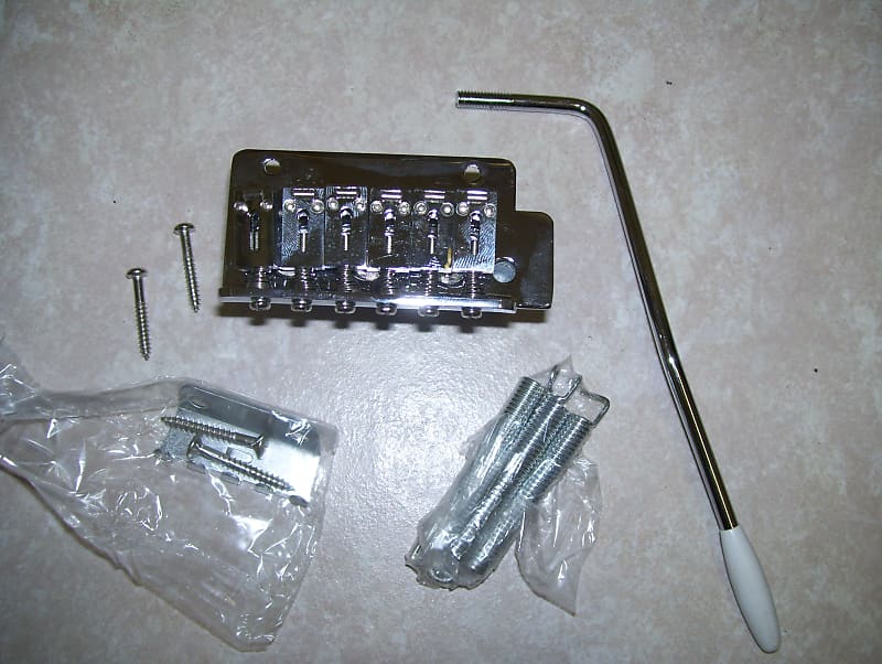 Guitar tailpiece or bridge kit. | Reverb