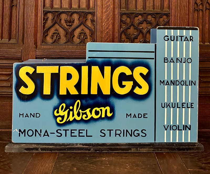 1930s-40’s Gibson guitars dealer music store string display. | Reverb
