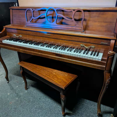 Baldwin Upright Piano Euro Style in American Walnut Finish Baldwin Upright Piano Euro Style in American Walnut Finish