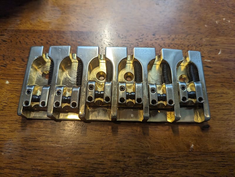 Hipshot A Style 6-string bass bridge. Gold plated brass, 20mm | Reverb