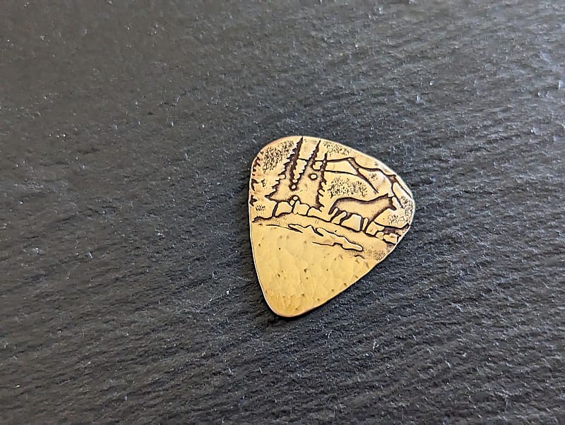 brass guitar pick - playable with wolf and forest | Reverb