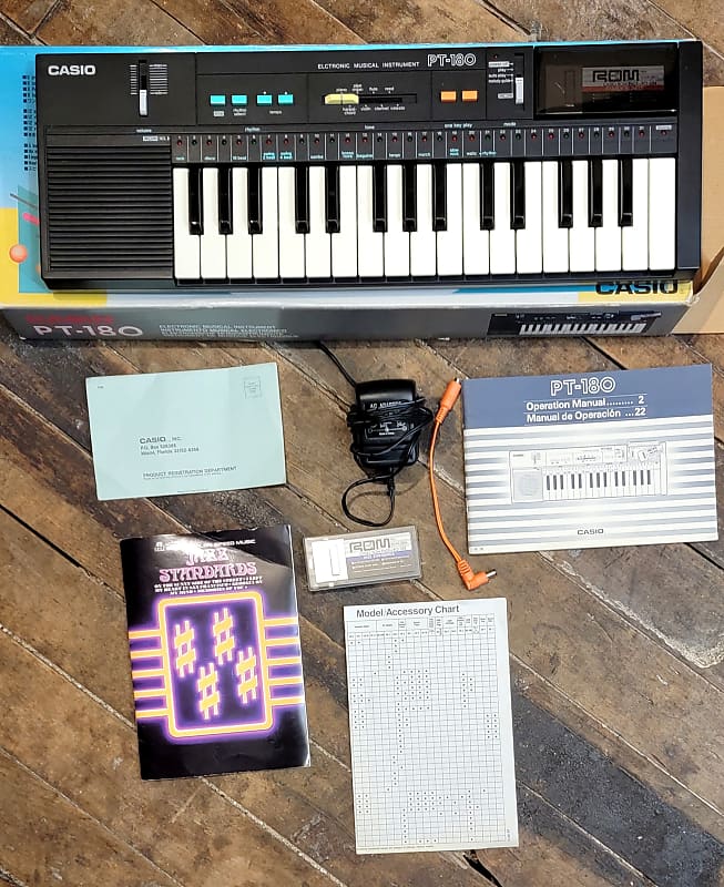 Casio PT-180 32 Mini Key Keyboard with 2 Rom Packs and power | Reverb