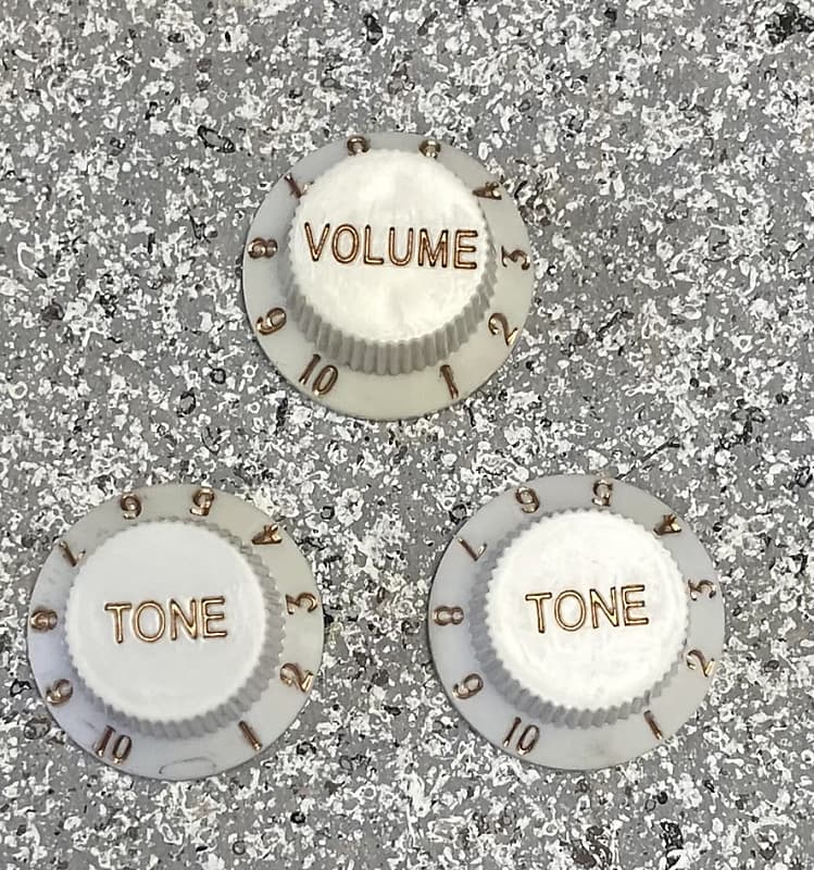 Pro Parts Strat Style Knobs 1 Set of 3 White w/Gold lettering | Reverb