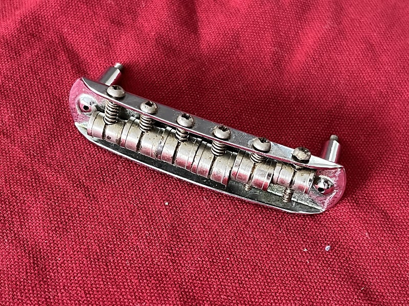 Vintage 1964 1965 1966 Fender Mustang guitar bridge | Reverb