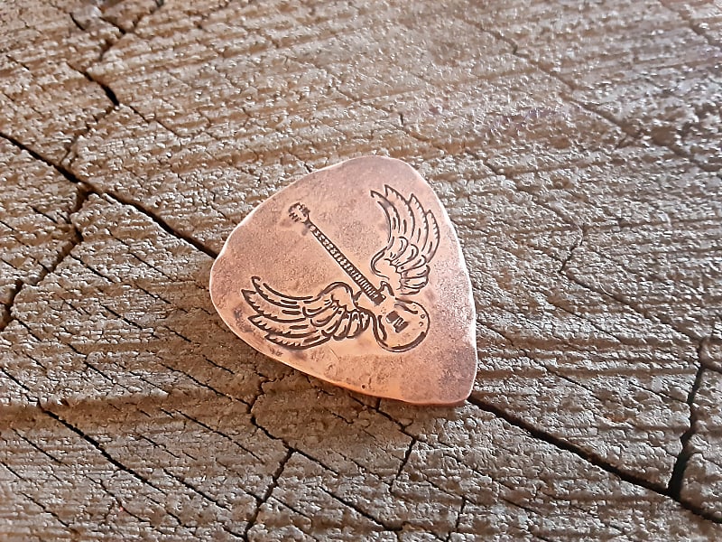 copper guitar pick with winged guitar - playable | Reverb