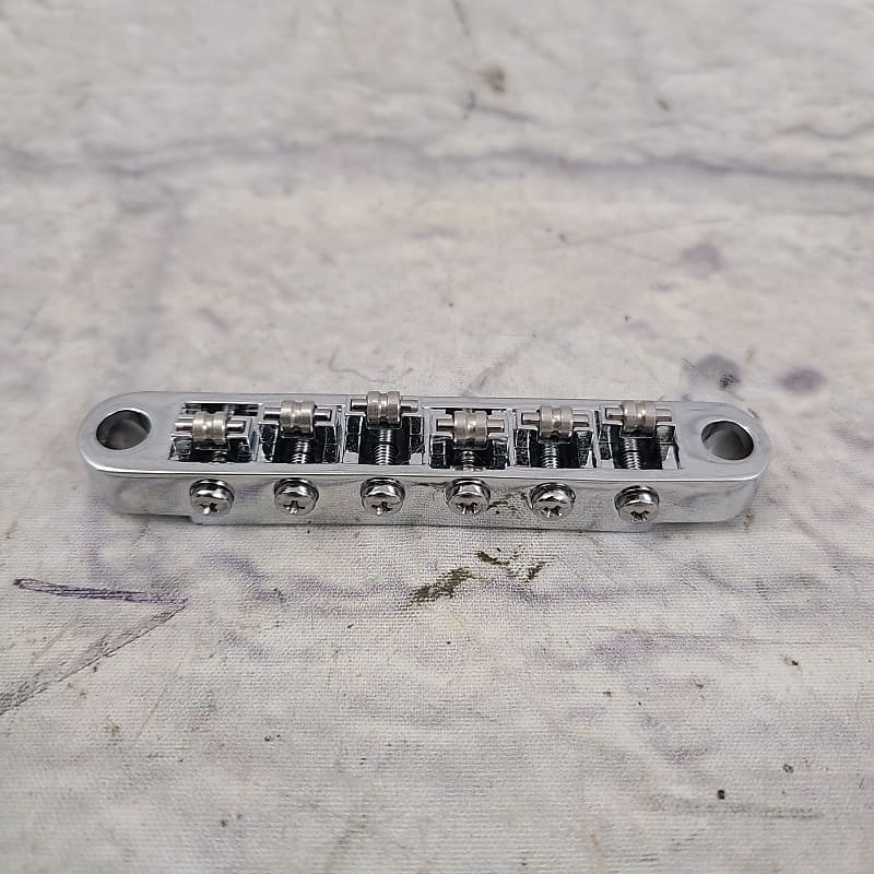 Chrome Roller Saddle Bridge | Reverb