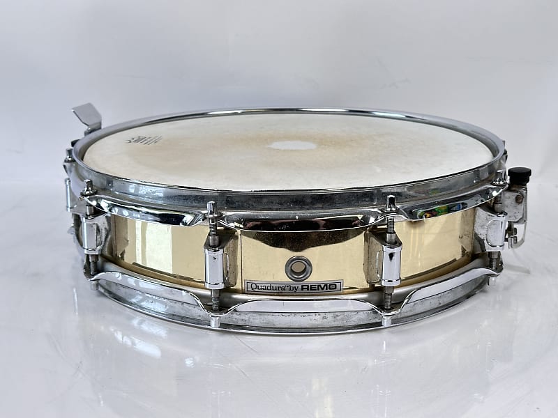 Remo Quadura Brass 4" x 14” Piccolo Snare Drum | Reverb