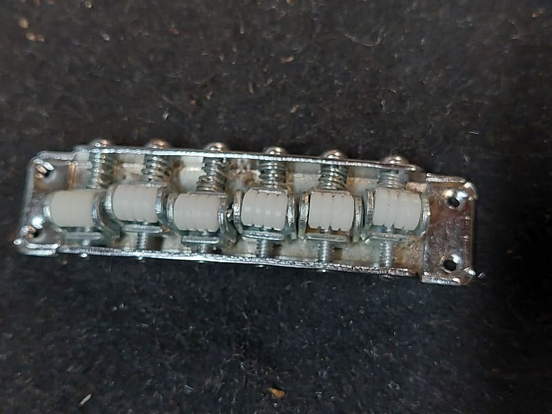 Import Nylon Insert Bridge 2 7\8 ×7/16" Screw Spacing 1970s | Reverb