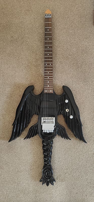 Winged headless guitar. | Reverb UK