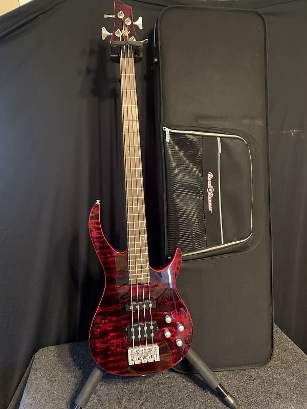Rogue 4-String Bass Guitar Transparent Red w/ Road Runner | Reverb