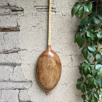Khomys is a Khakassian two-stringed plucked instrument, a | Reverb