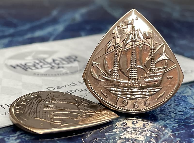 The Highland plectrum Co. One 1966 Half Penny Coin Plectrum. | Reverb