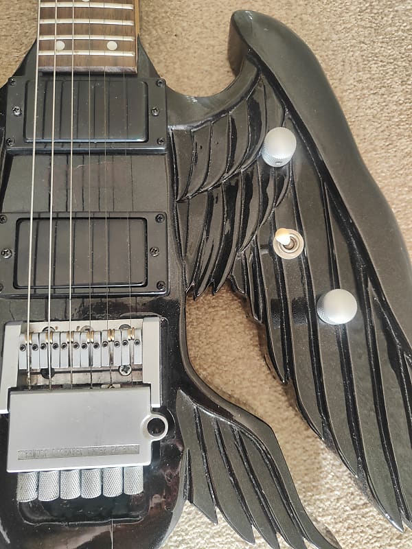Winged headless guitar. | Reverb UK