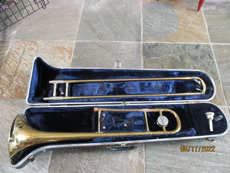 Conn brand trombone with case and mouthpiece | Reverb