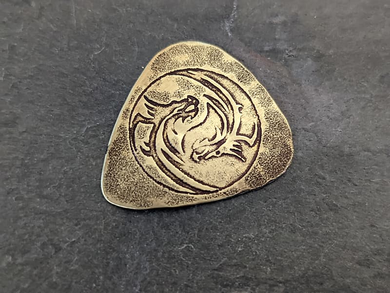 brass guitar pick - playable with wolves | Reverb