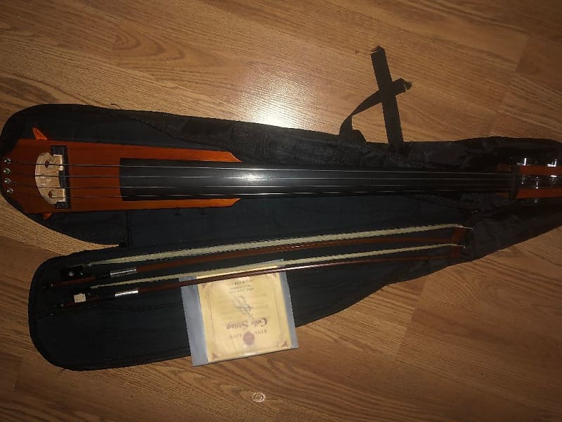 Electric Cello with custom bridge and two bows | Reverb