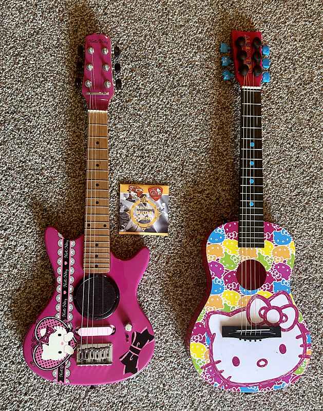 (2) Hello Kitty guitars - 1 w/ built in speaker & 1 acoustic | Reverb