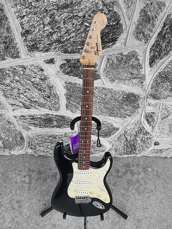 Squier Strat, Black with Pearloid Pickguard | Reverb