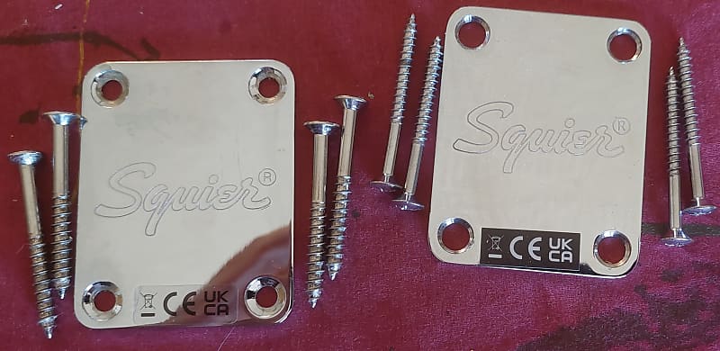 2 Chrome Squier logo neck plates with screws | Reverb