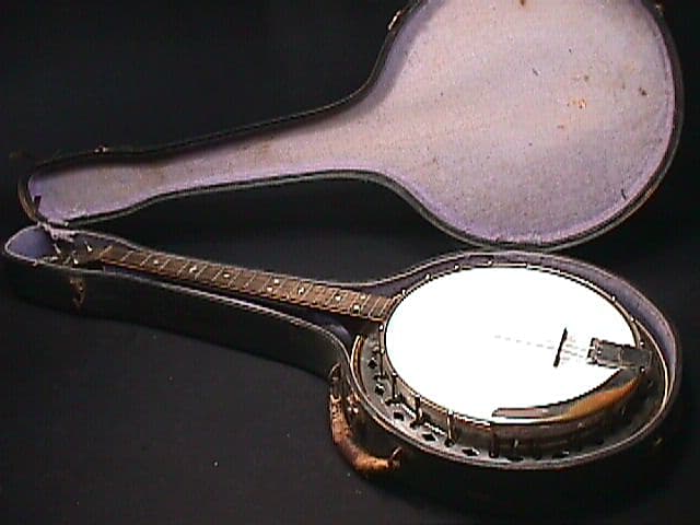 An Antique Conqueror Tenor Banjo qith Resonator in it's | Reverb