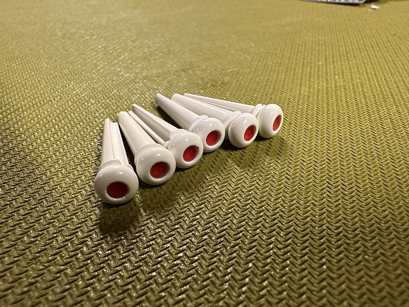 Martin Luxe Liquid Metal Bridge Pins Bone with Red Inlay | Reverb