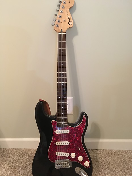 Squire Stratocaster (with red pickguard) Black | Reverb