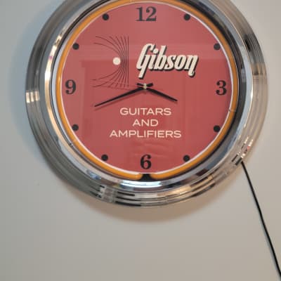 1950's/60's Style Gibson Guitars Neon Orange Wall Clock | Reverb